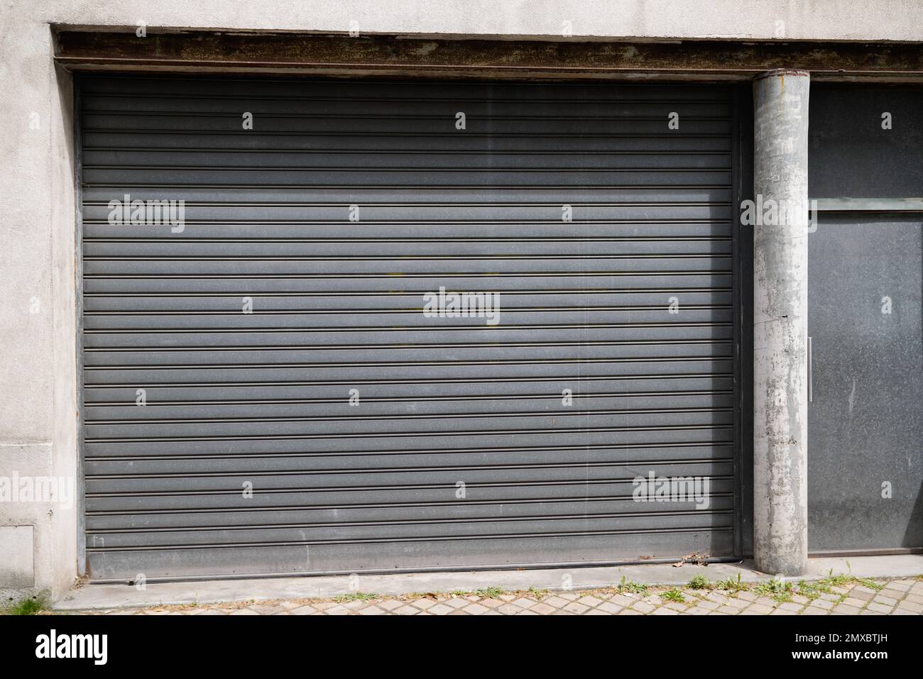 metallic gray curtain of facade store closed roller grey garage gate ...