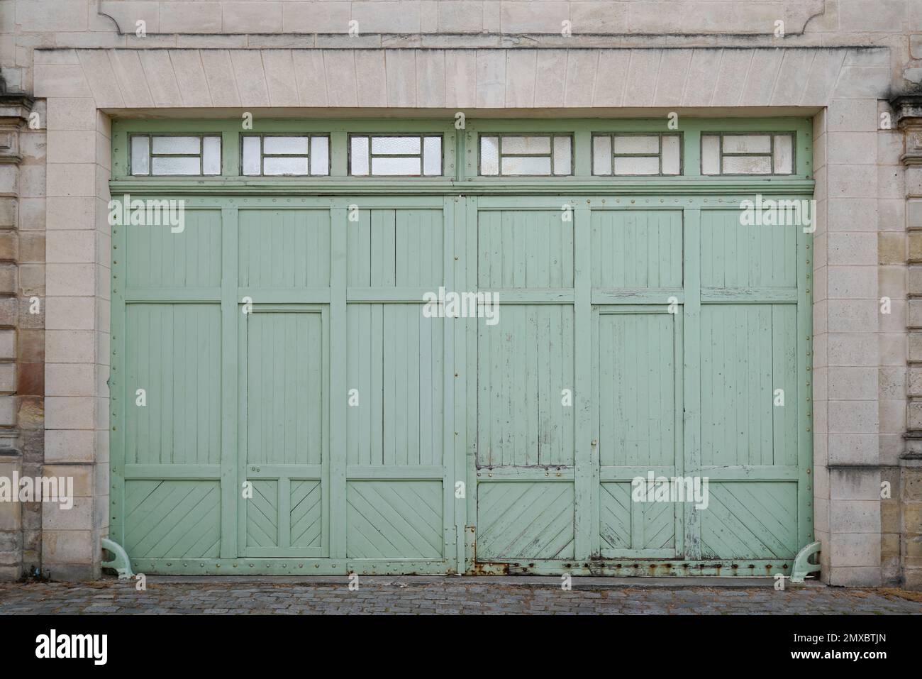 Double Wooden green ancient garage door old blue building entrance ...