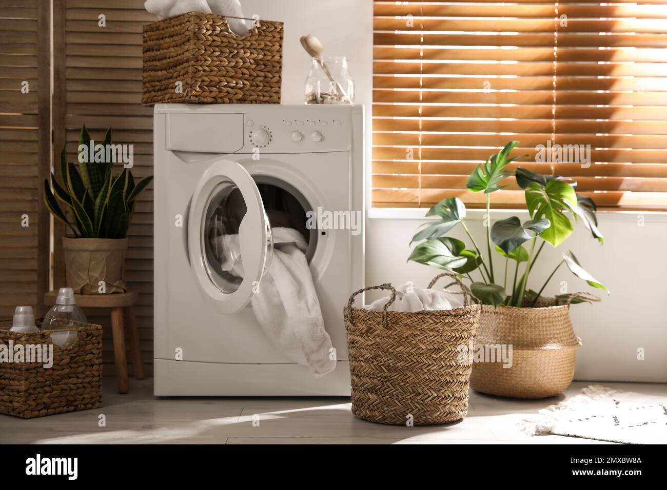 Stylish room interior with washing machine. Design idea Stock Photo - Alamy