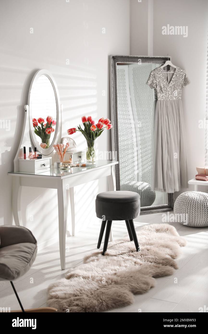 Stylish room interior with elegant dressing table and mirror Stock ...