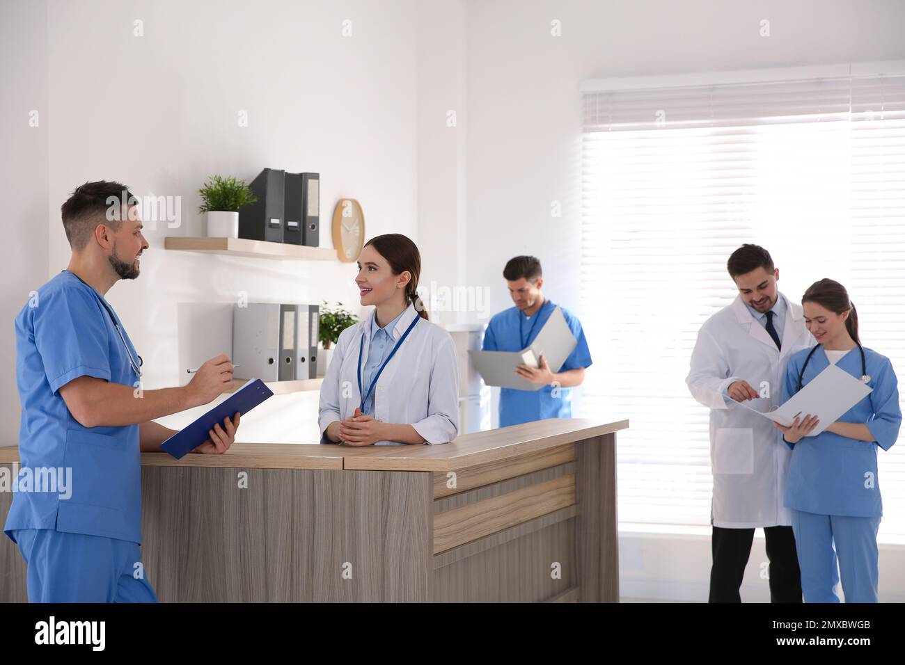 Group young doctors working together hi-res stock photography and ...