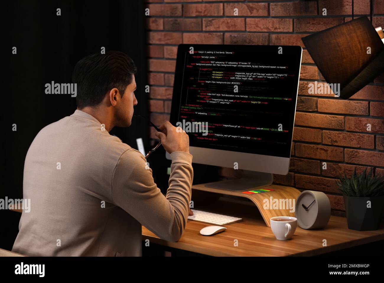 Professional programmer working with computer in office Stock Photo - Alamy