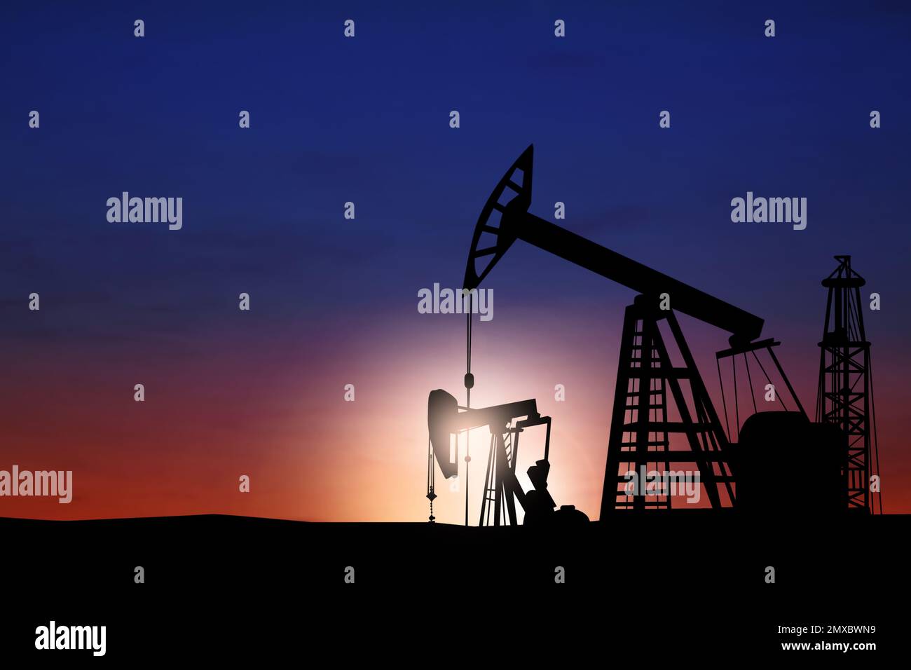 Silhouettes of crude oil pumps at sunset. Space for text Stock Photo ...