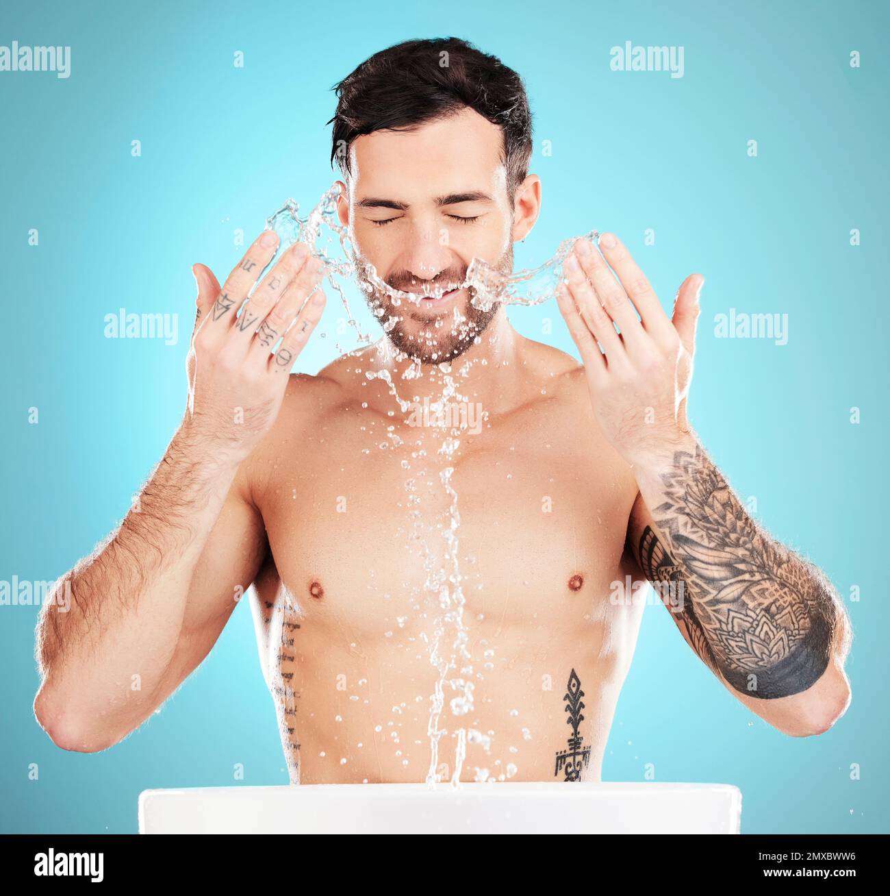Water splash, skincare and man cleaning face, morning detox treatment ...