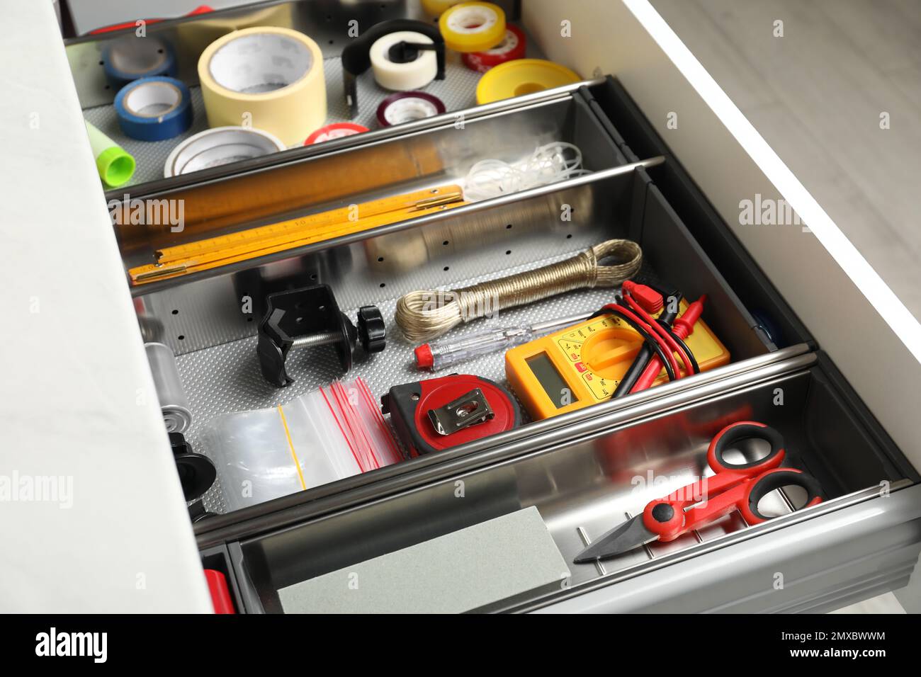 Set of instruments in open desk drawer indoors, closeup Stock Photo - Alamy