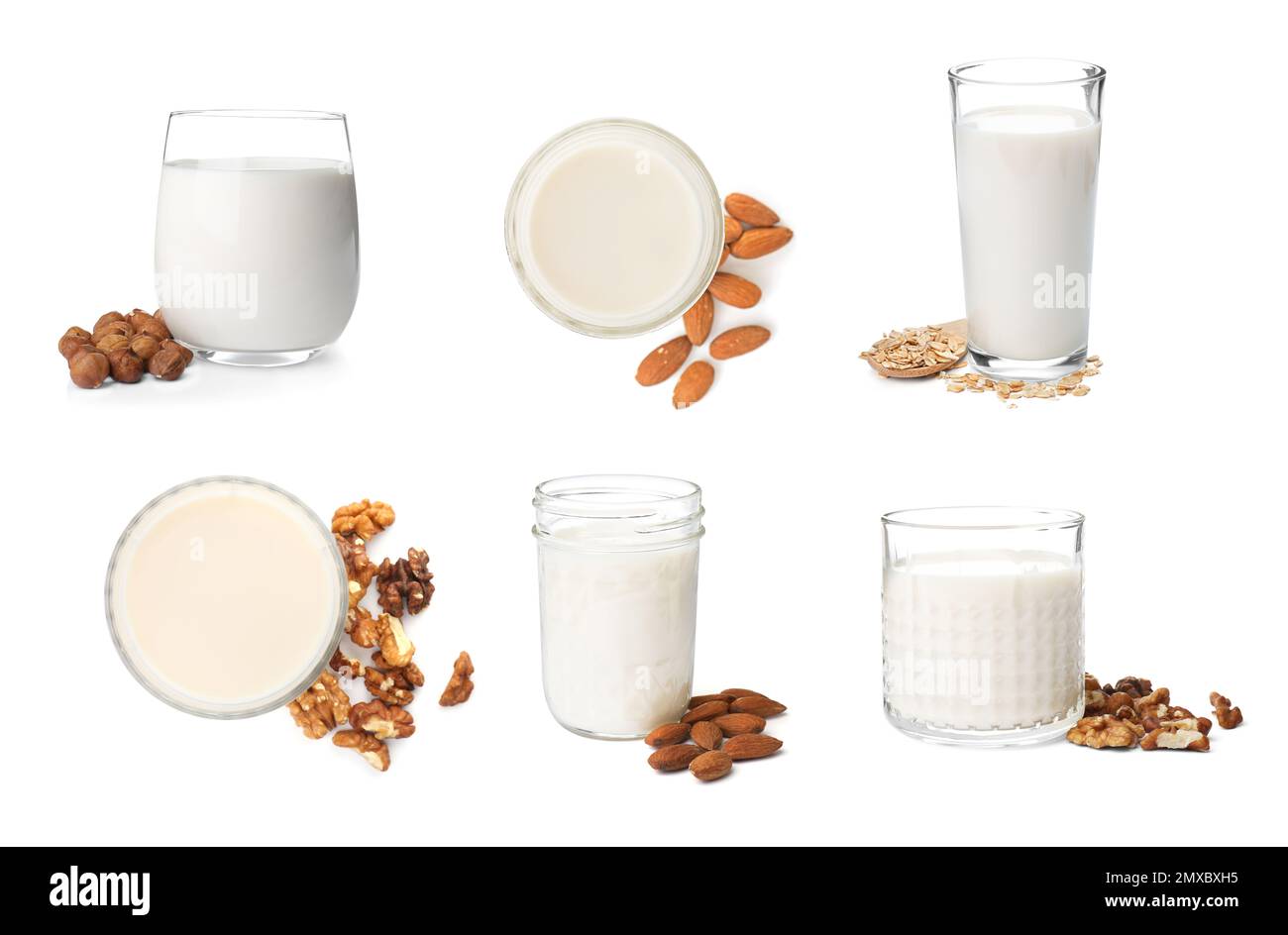Set with different types of organic milk on white background. Natural ...