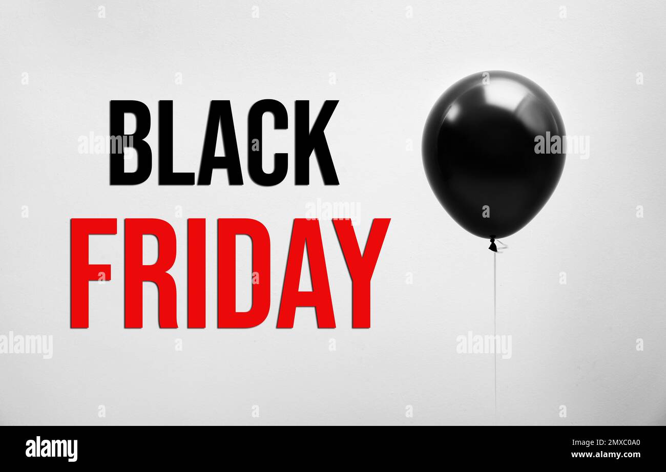 Text BLACK FRIDAY and big balloon on light background Stock Photo - Alamy