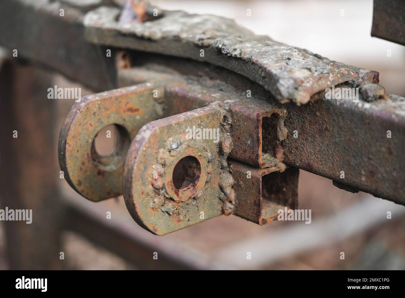old rusty metal spare parts for work in agriculture Stock Photo - Alamy