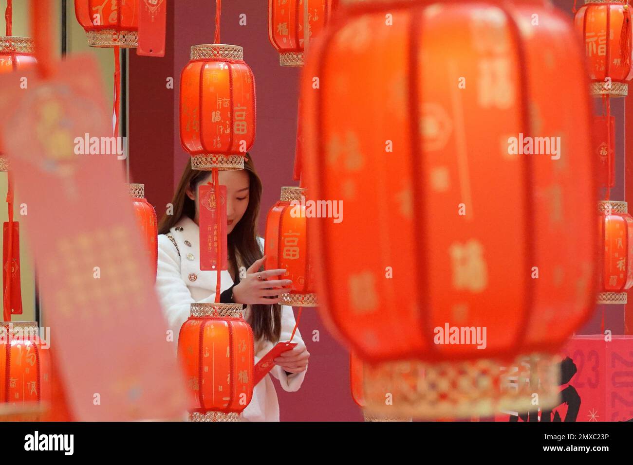 YANTAI, CHINA - FEBRUARY 3, 2023 - People guess lantern riddles at a ...