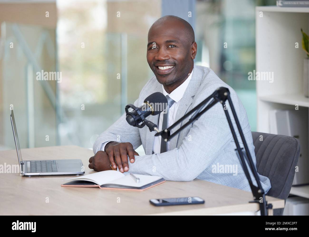 Podcast, portrait and black man with microphone, radio broadcast or ...