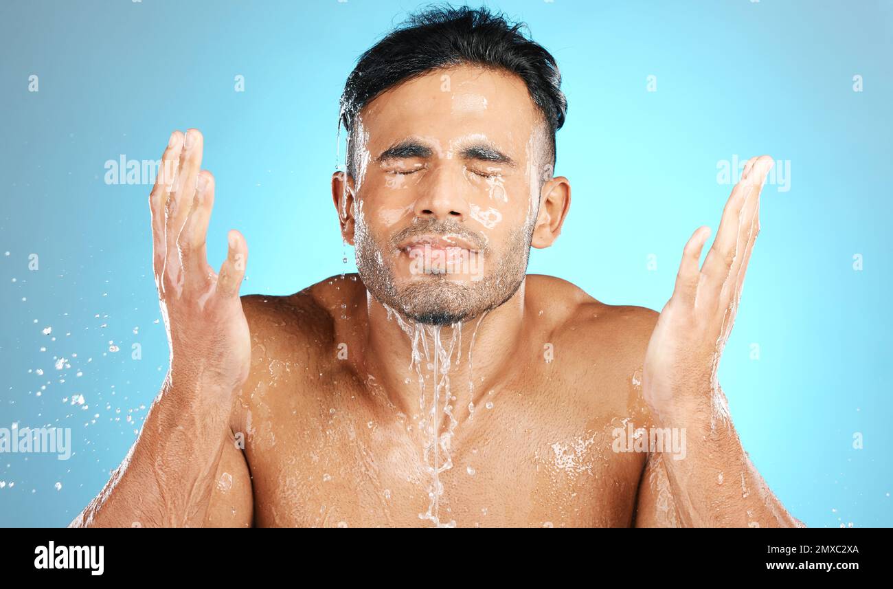 Water splash, face and man in studio for skincare, wellness and ...