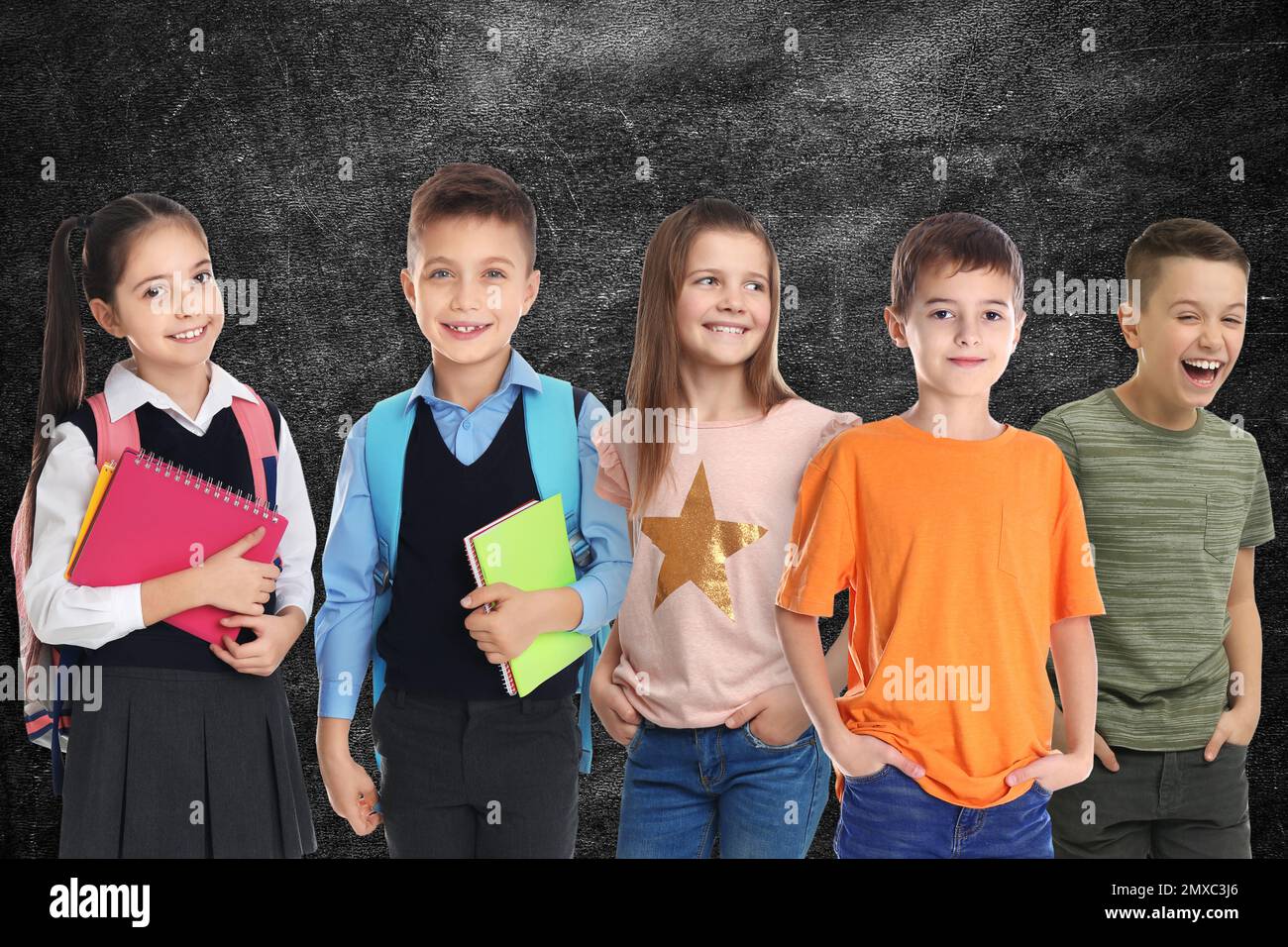 Group of cute school children and chalkboard on background Stock Photo ...