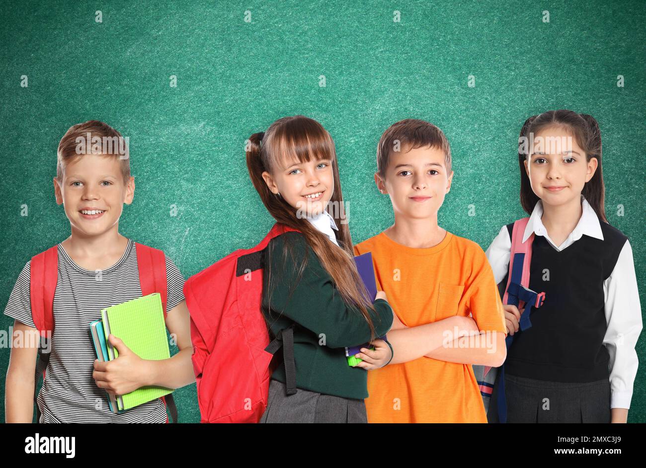 Group of cute school children and chalkboard on background Stock Photo ...