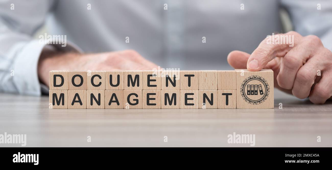 Wooden blocks with symbol of document management concept Stock Photo ...