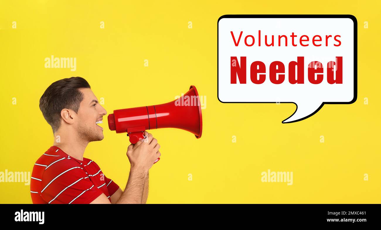 Volunteers needed megaphone yellow hi-res stock photography and images ...