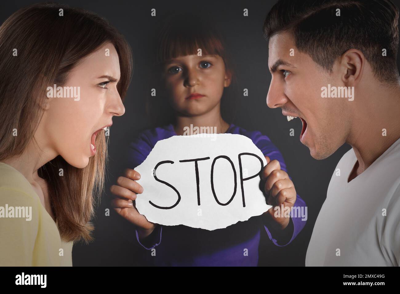Double exposure of sad little girl with sign STOP and her arguing ...