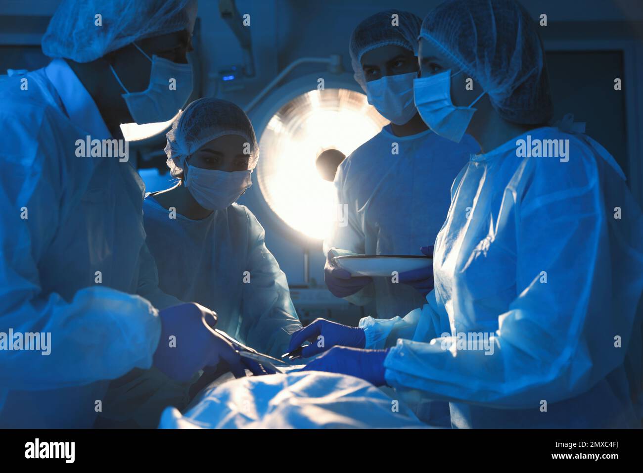 Team of professional doctors performing operation in surgery room Stock ...