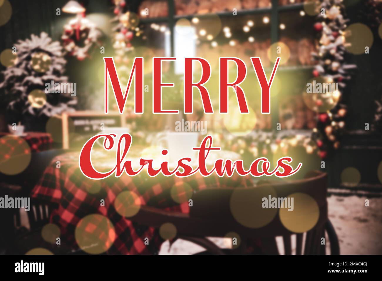 Blurred view of modern outdoor cafe and phrase Merry Christmas. Holiday ...