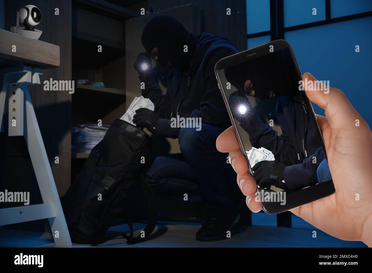 Man monitoring situation at his house with CCTV app on smartphone ... Man monitoring situation at his house with CCTV app on smartphone ...