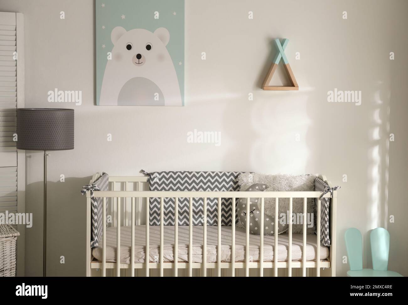 Cute baby room interior with crib and decor elements Stock Photo - Alamy