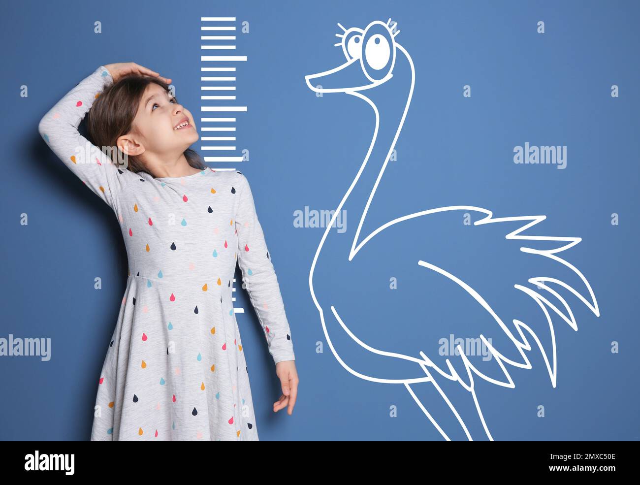 Little girl measuring height and drawing of ostrich on blue background ...