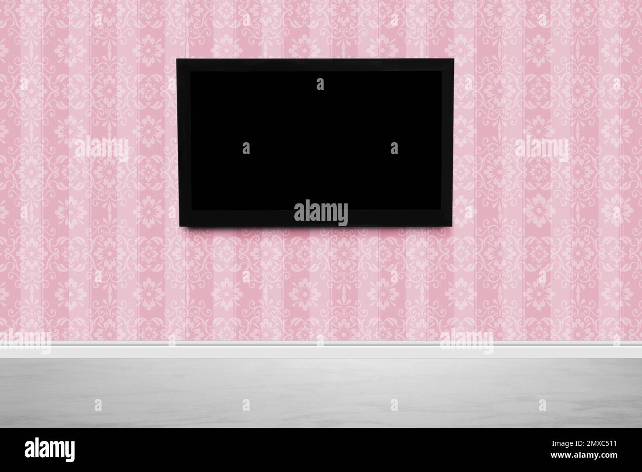 Modern TV on pink wall in room. Space for design Stock Photo - Alamy