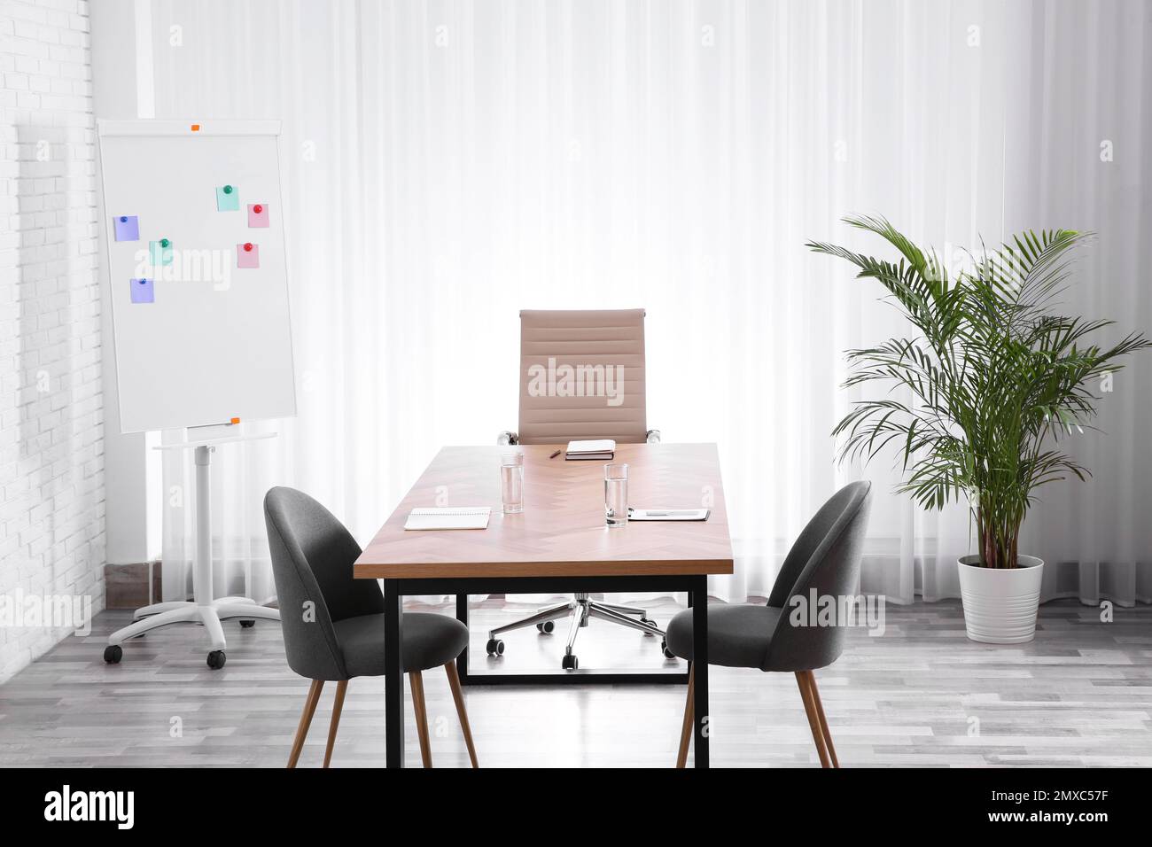 Interior of modern office with table and chairs Stock Photo - Alamy