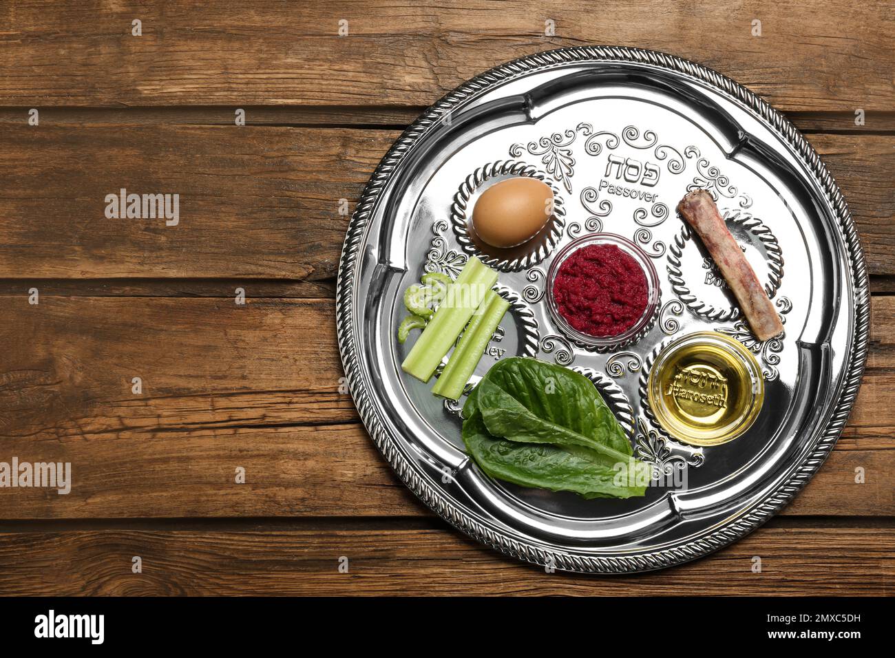 Passover Seder plate (keara) on wooden table, top view with space for ...