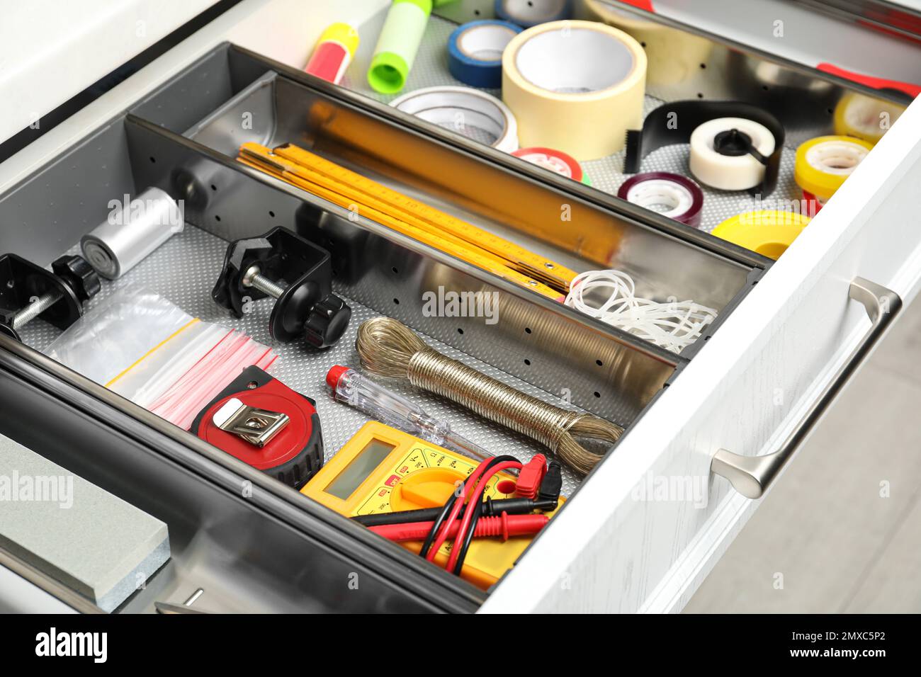 Set of instruments in open desk drawer indoors, closeup Stock Photo - Alamy