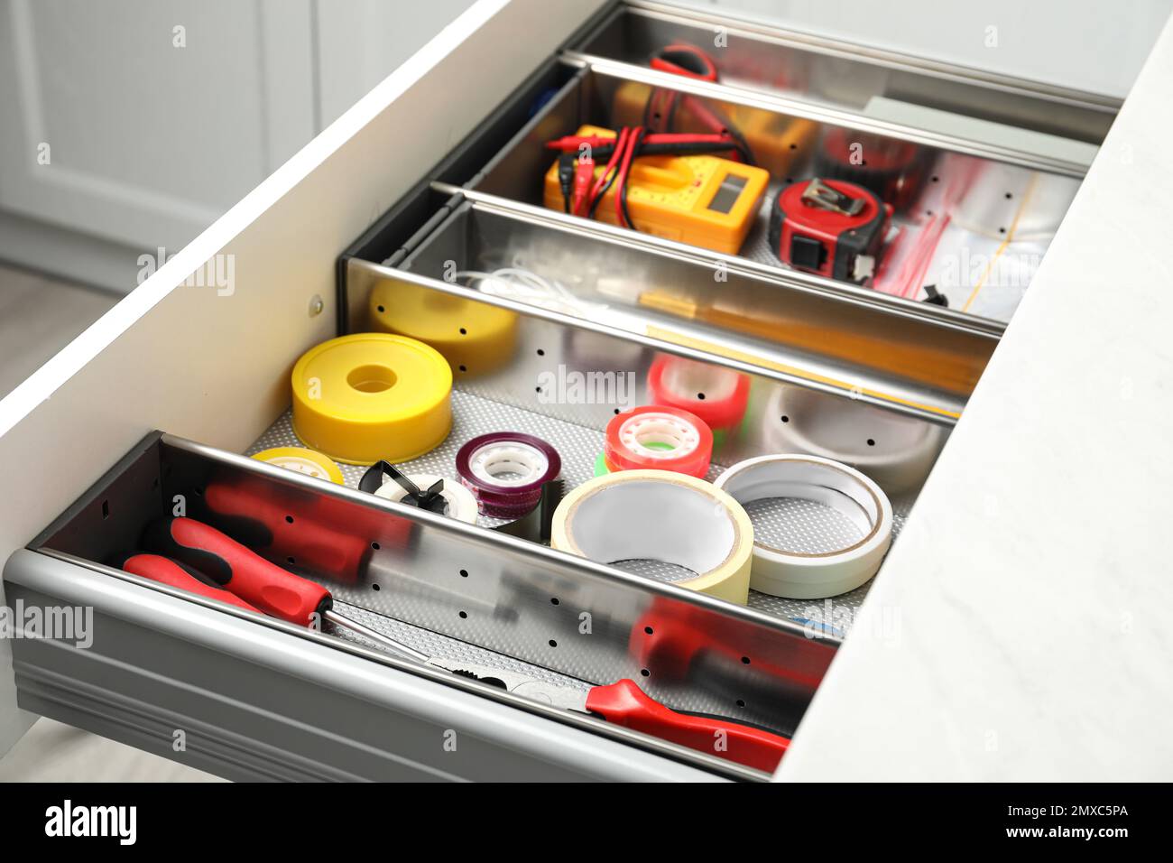 Set of instruments in open desk drawer indoors Stock Photo - Alamy