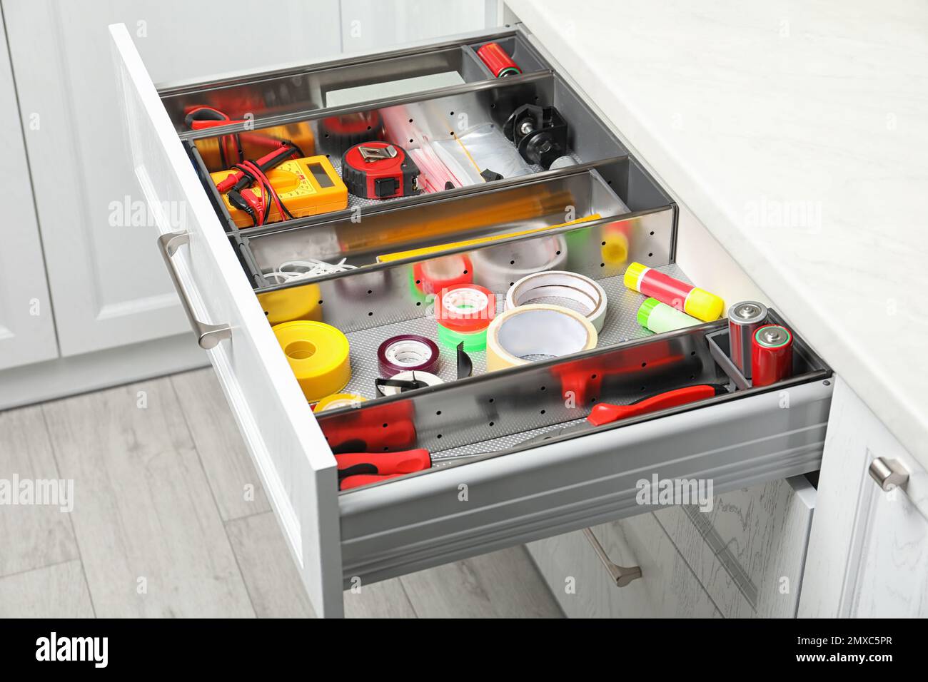 Set of instruments in open desk drawer indoors Stock Photo - Alamy