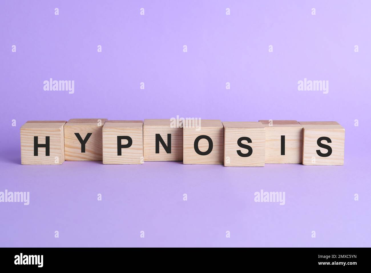 Wooden blocks with word HYPNOSIS on violet background Stock Photo - Alamy