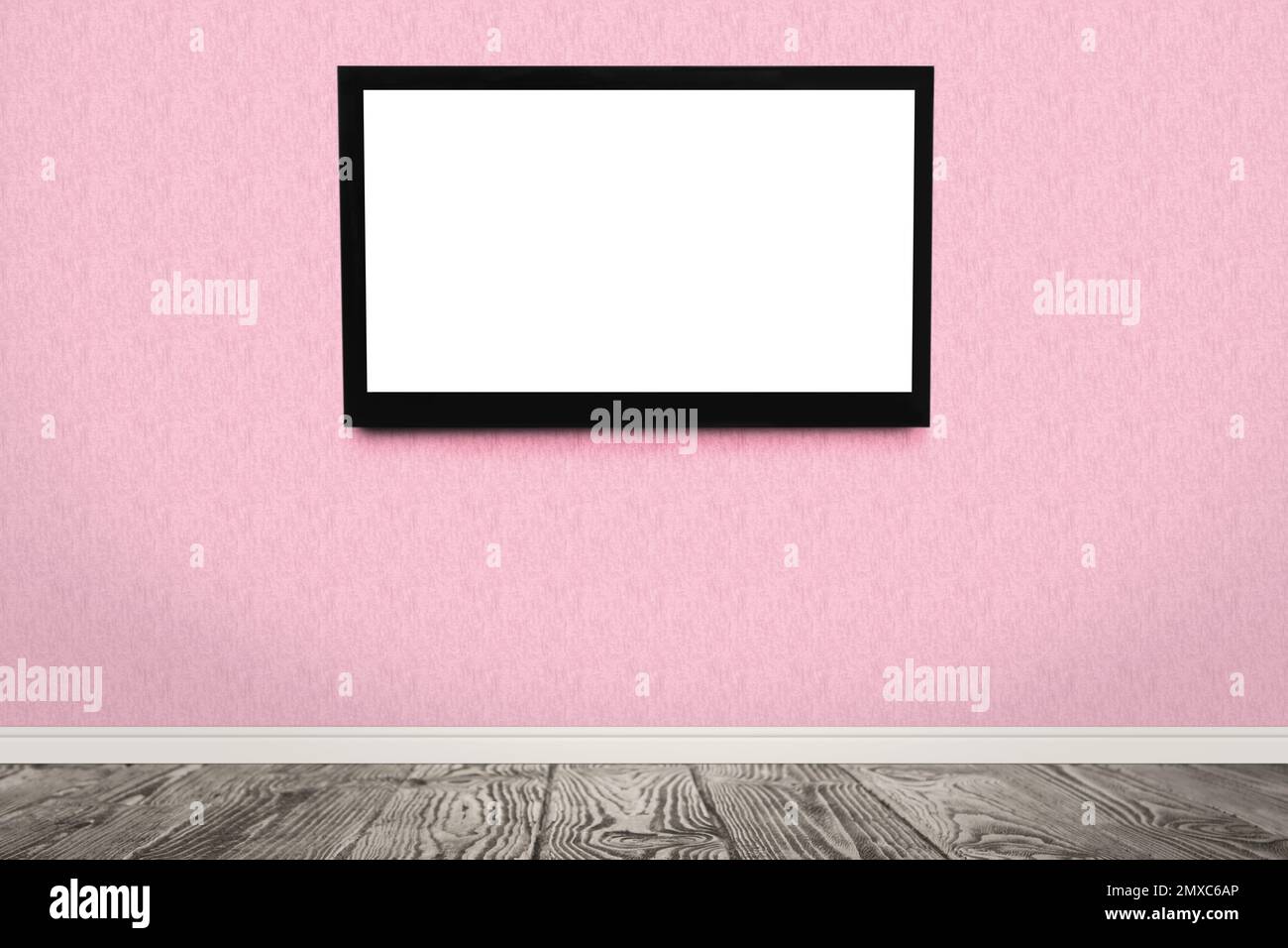 Modern TV on pink wall in room. Space for design Stock Photo - Alamy