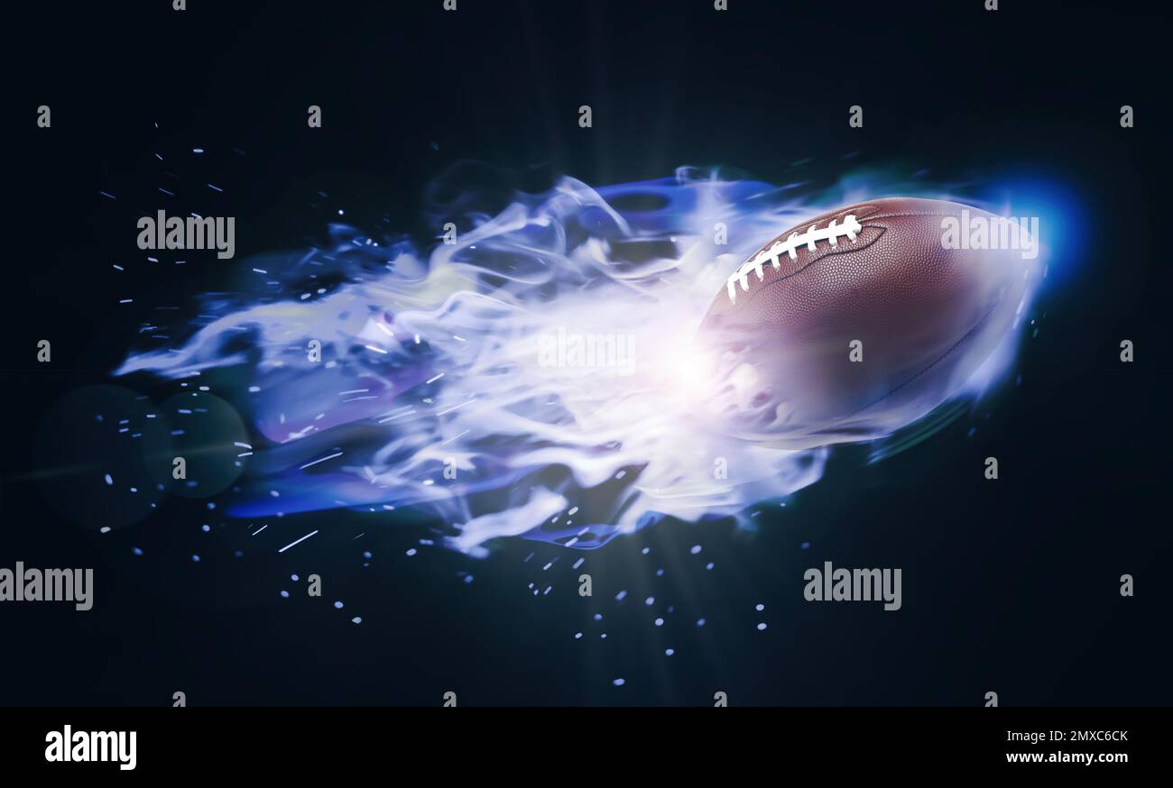 Rugby ball with bright flame flying on black background Stock Photo - Alamy