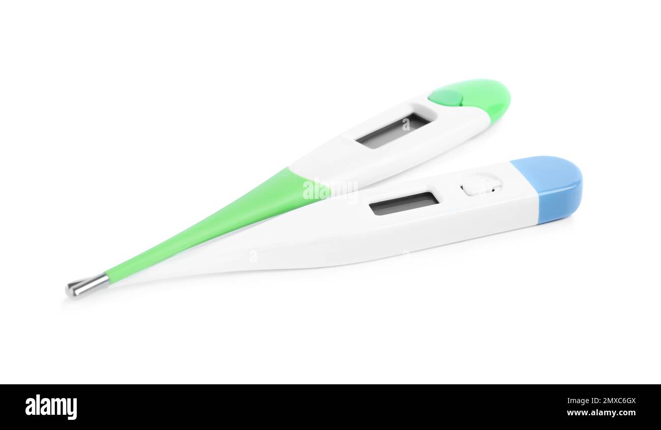 Modern digital thermometers on white background. Measuring temperature ...