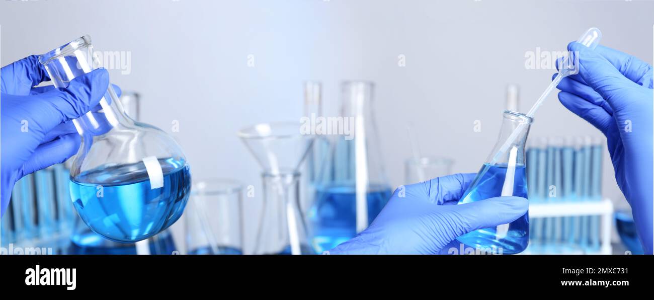 Scientists doing research and analysis in chemical laboratory, closeup ...