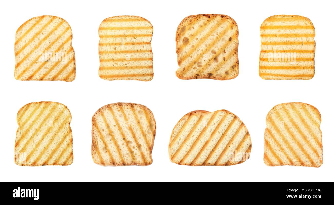 Set with toasted slices of wheat bread on white background, top view ...