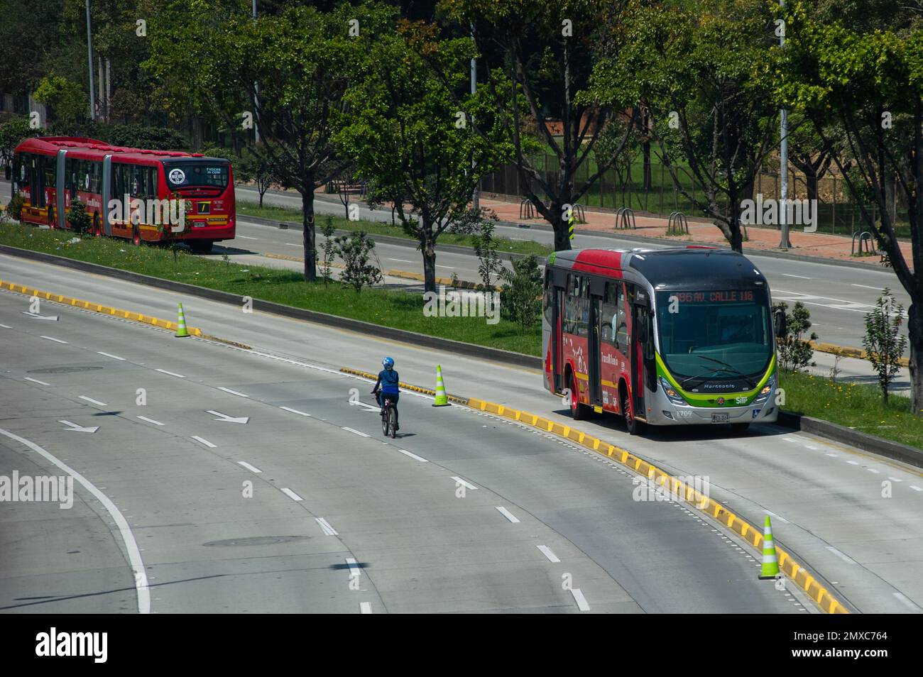 Bogota's public bus system 'Transmilenio' runs along Bogota's 'Ciclovia ...