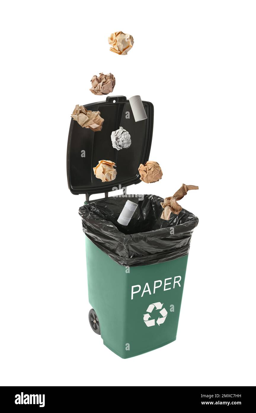Different paper garbage falling into trash bin. Waste management and ...