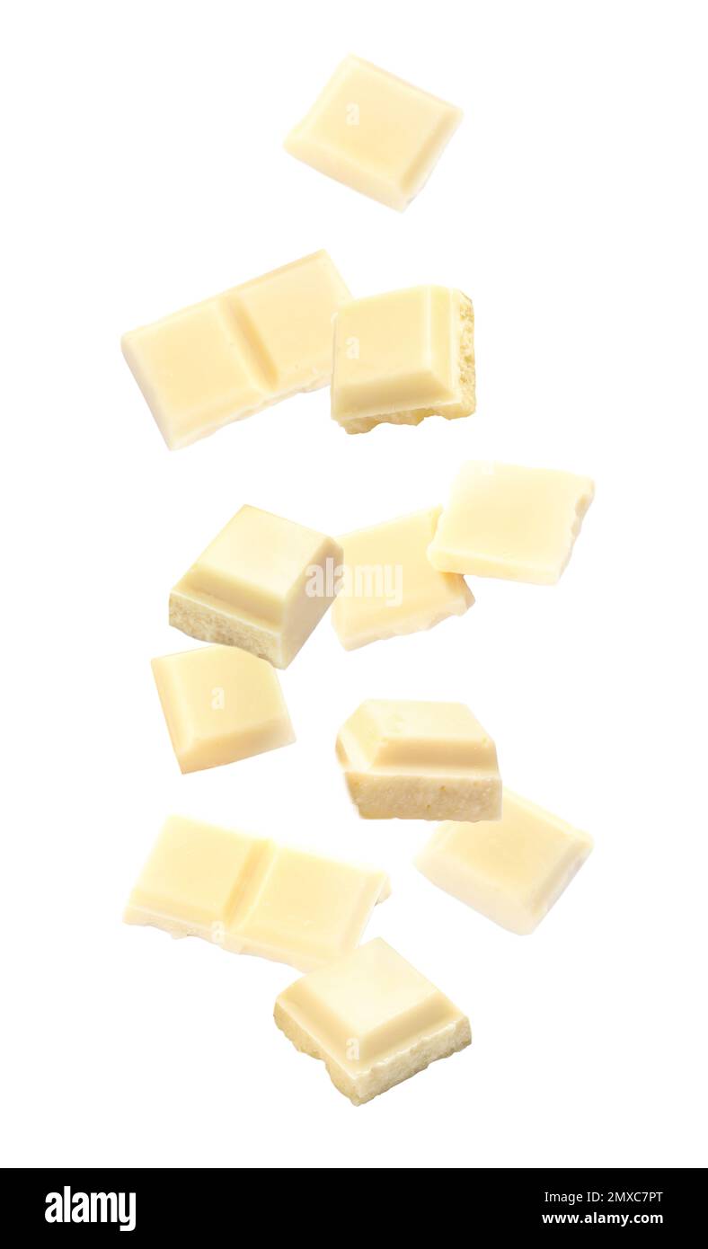 Delicious chocolate pieces falling on white background Stock Photo - Alamy