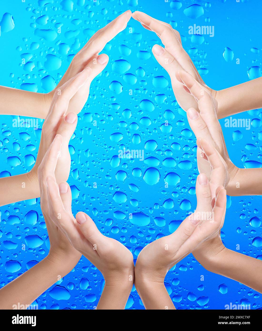 Men forming water drop with their hands on blue background. Ecology ...
