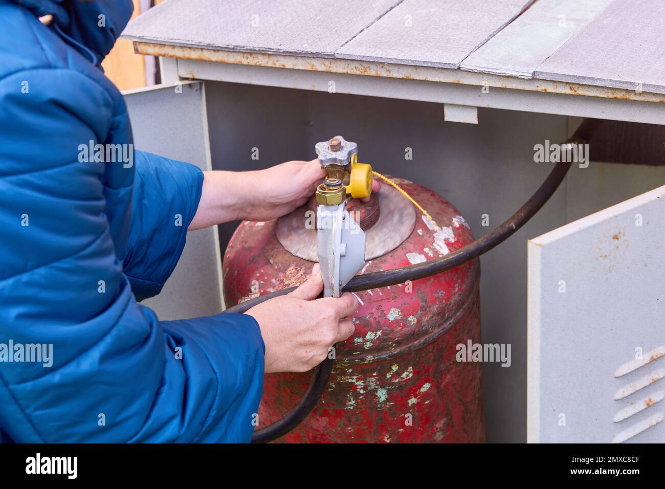 Full gas cylinder is placed in closet in front of house Stock Photo - Alamy