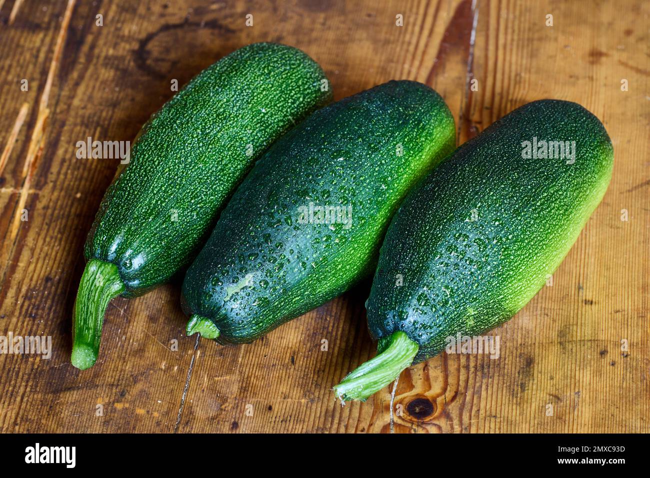 Crop of vegetable marrows lies on table in farmer house Stock Photo - Alamy