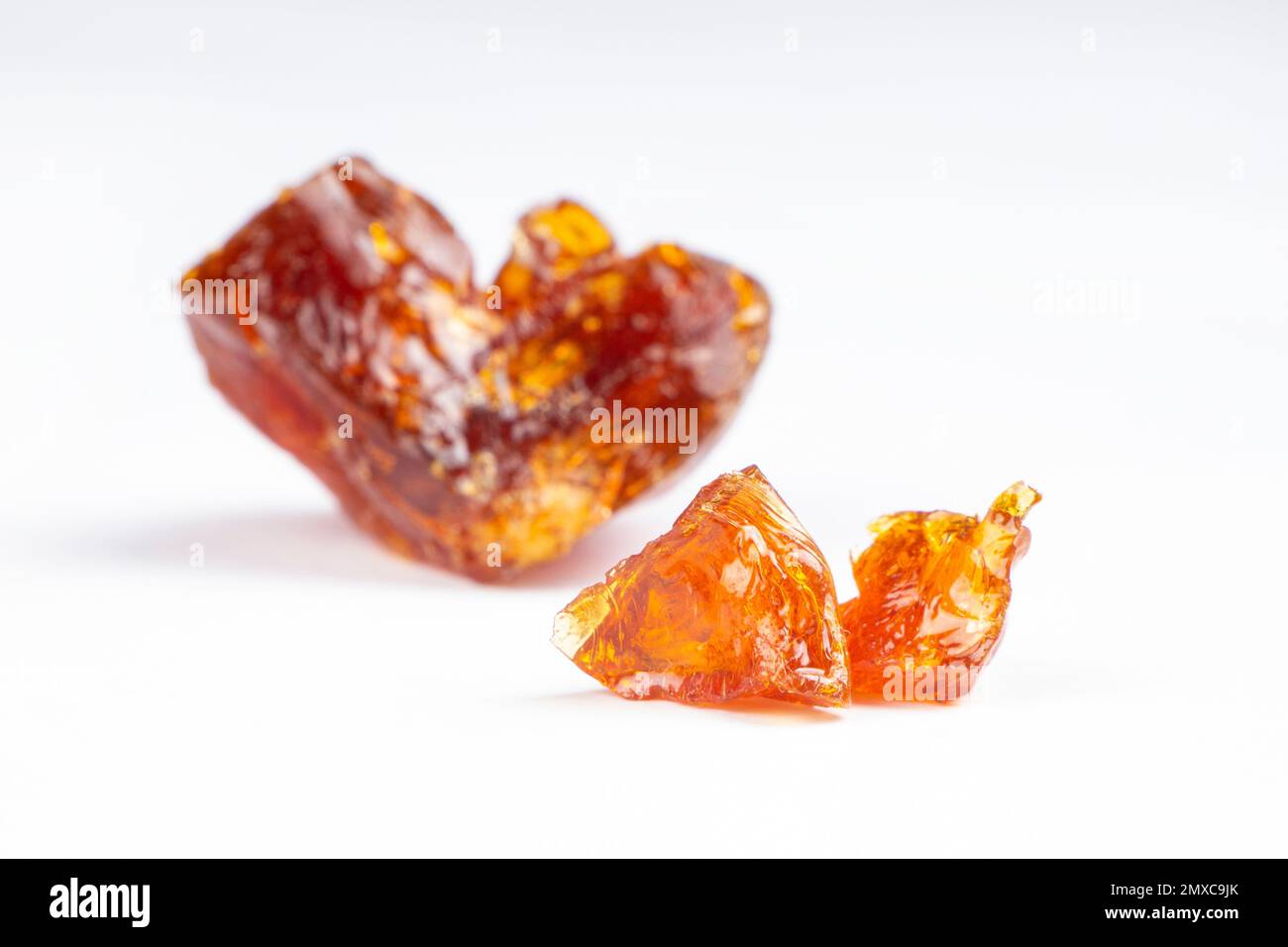 amber stones of concentrated thc extract resin isolated on white ...