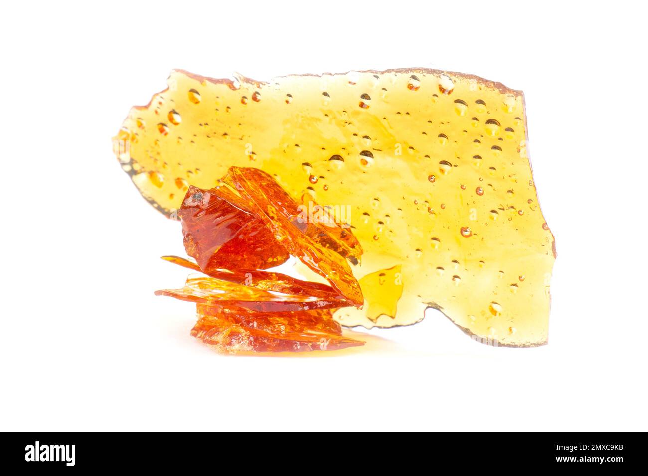 golden wax stones of concentrated thc extract resin isolated on white ...