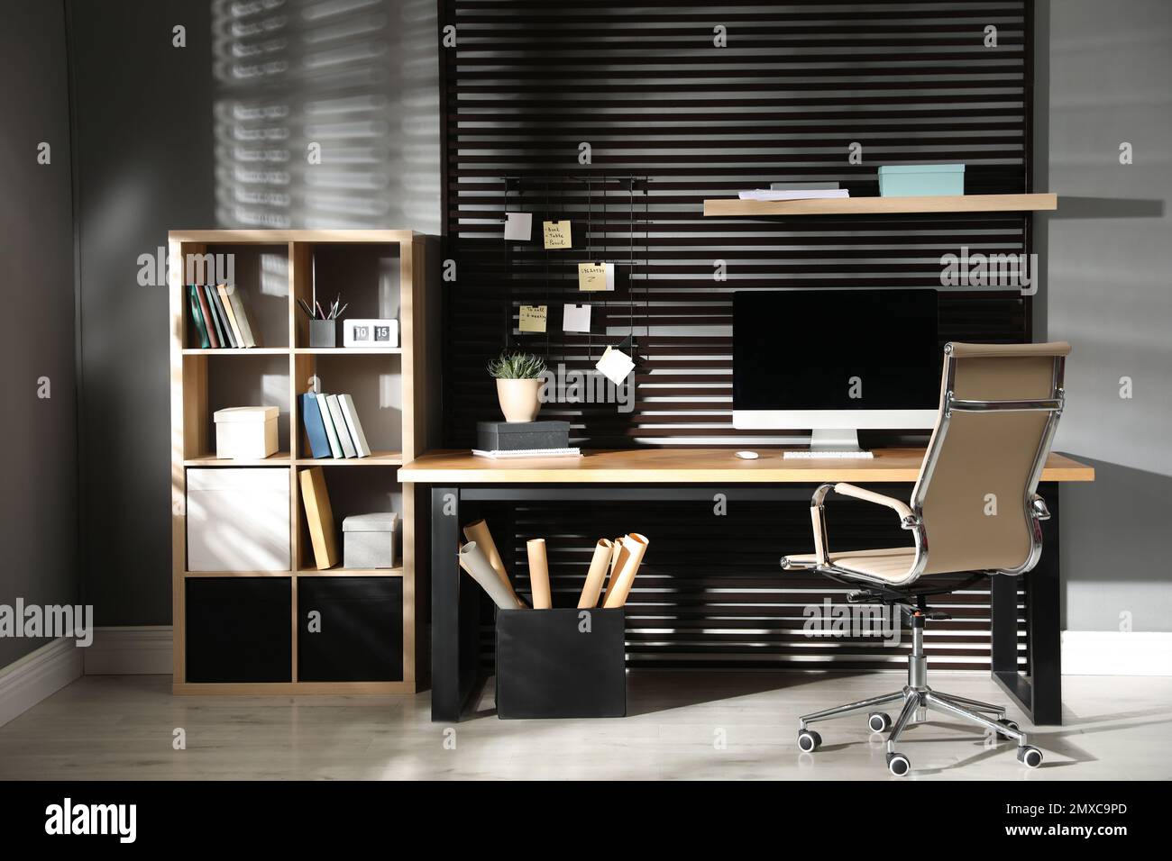 Comfortable workplace with computer and office chair. Stylish room ...