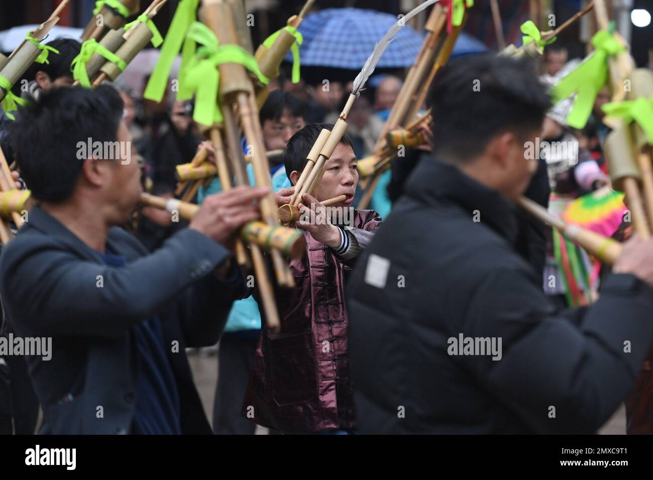 RONGSHUI, Feb. 3, 2023 (Xinhua) -- People of Miao ethnic group blow ...