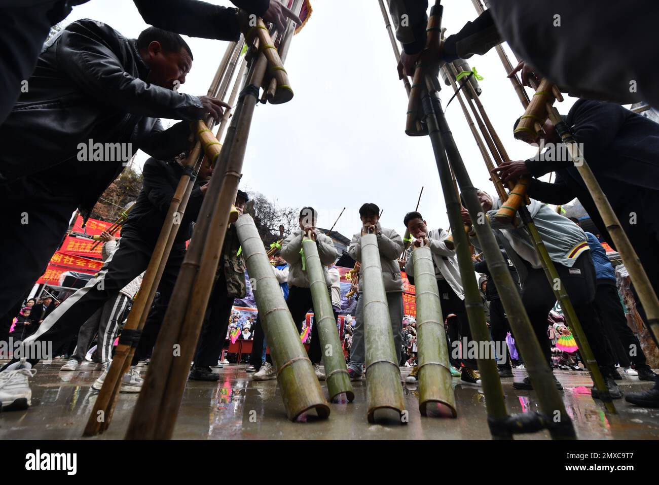 RONGSHUI, Feb. 3, 2023 (Xinhua) -- People of Miao ethnic group blow ...