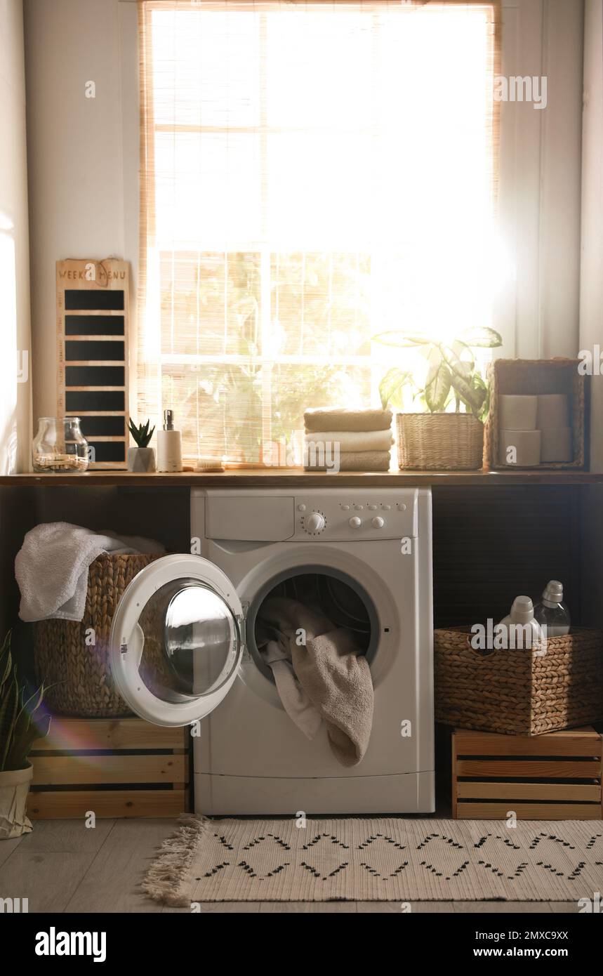 Stylish room interior with washing machine. Design idea Stock Photo - Alamy