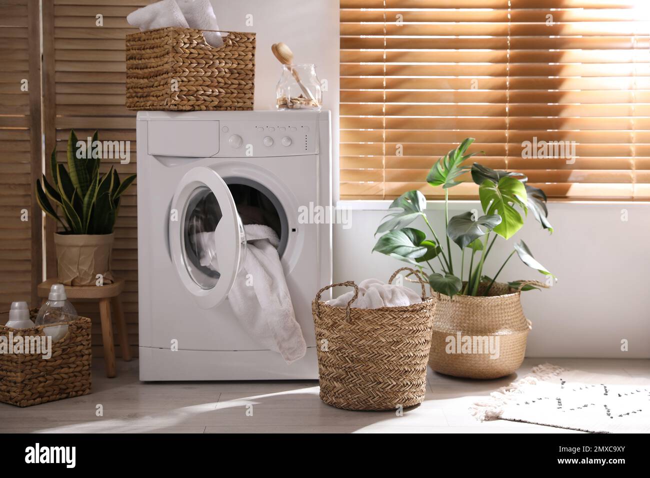 Stylish room interior with washing machine. Design idea Stock Photo - Alamy